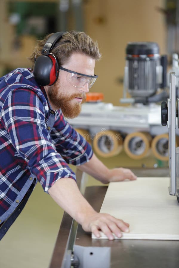Carpenter Working on Electric Buzz Saw Cutting Boards Stock Image ...