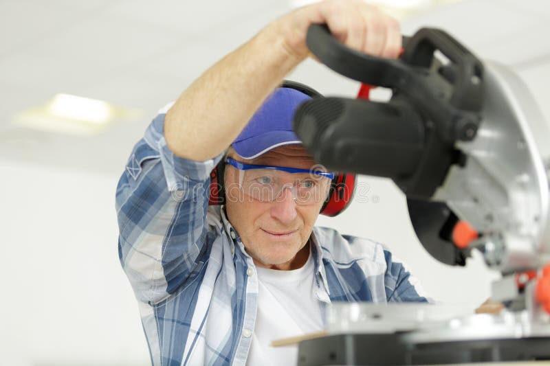 Carpenter Working on Electric Buzz Saw Cutting Boards Stock Photo ...