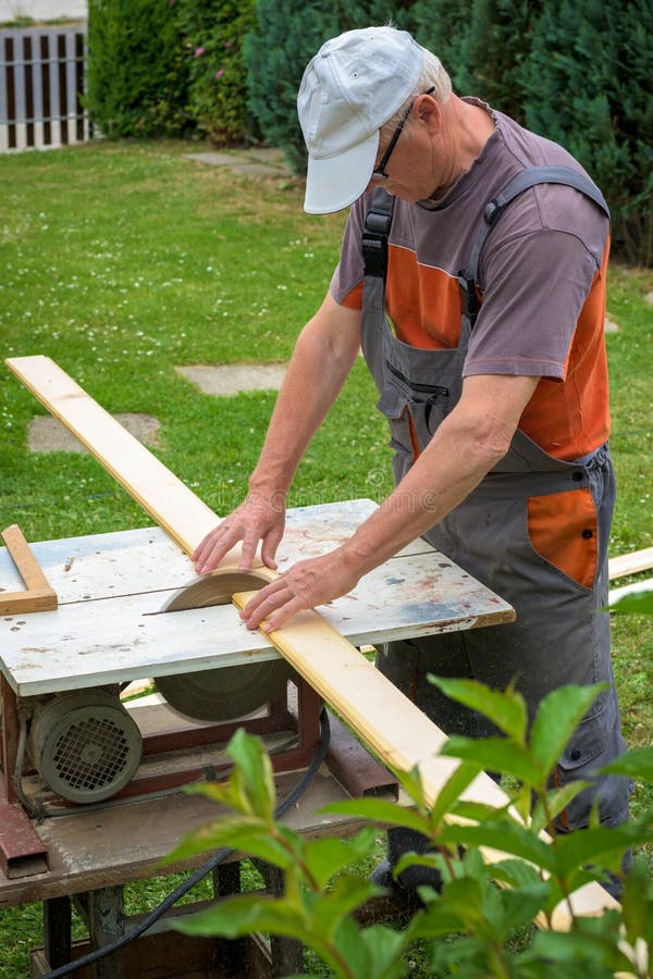 Carpenter Working with Electric Buzz Saw Stock Photo - Image of craft ...