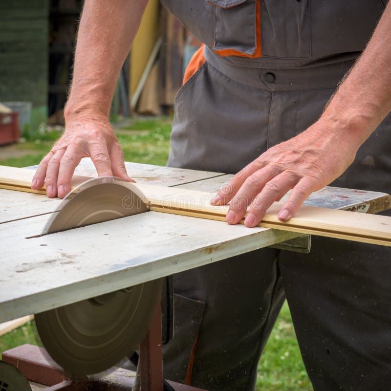 Carpenter Working with Electric Buzz Saw Stock Image - Image of people ...