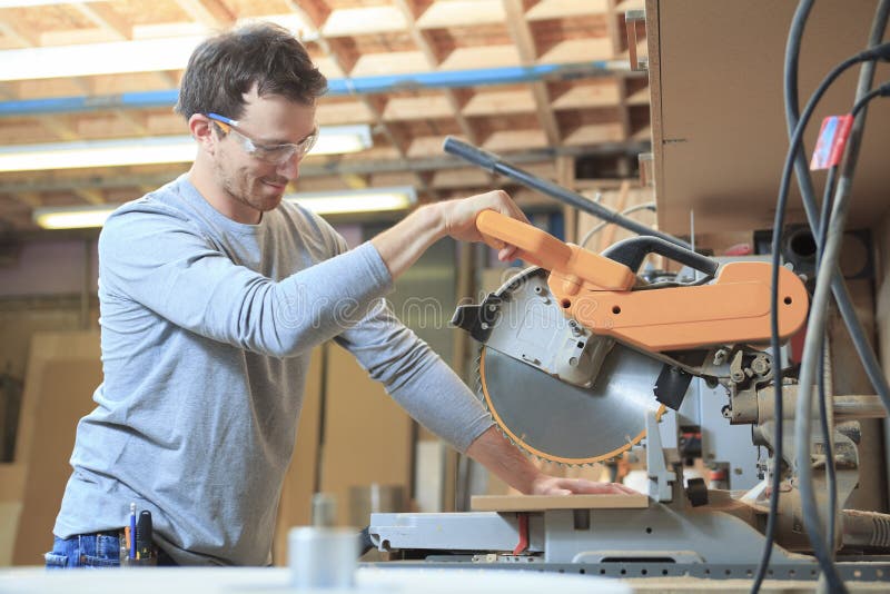A Carpenter Working Hard at the Shop Stock Photo - Image of board ...