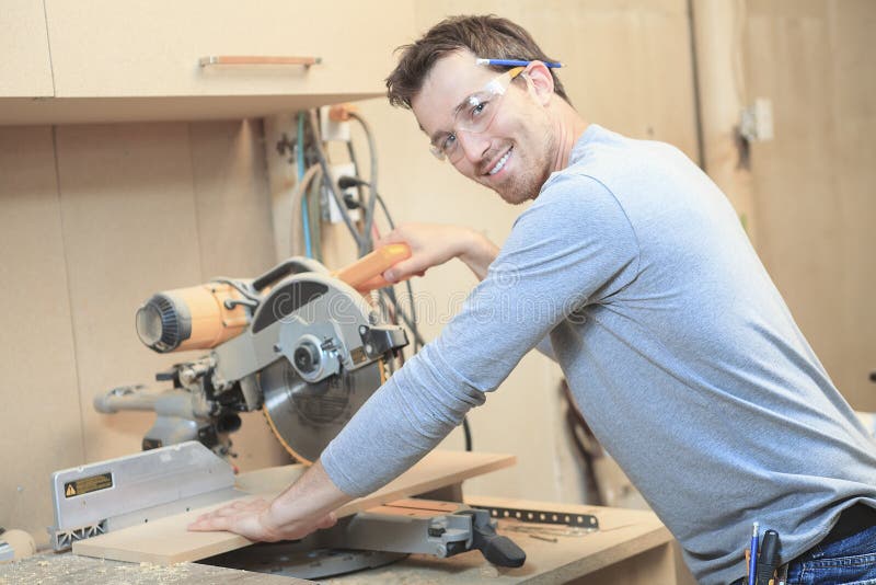 A Carpenter Working Hard at the Workshop Stock Photo - Image of ...