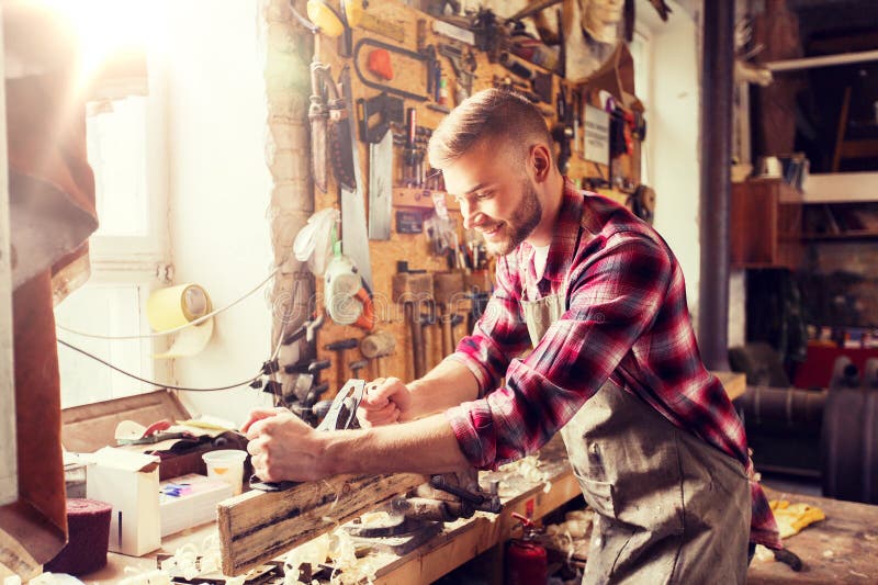 Carpenter Working with Plane and Wood at Workshop Stock Photo - Image ...