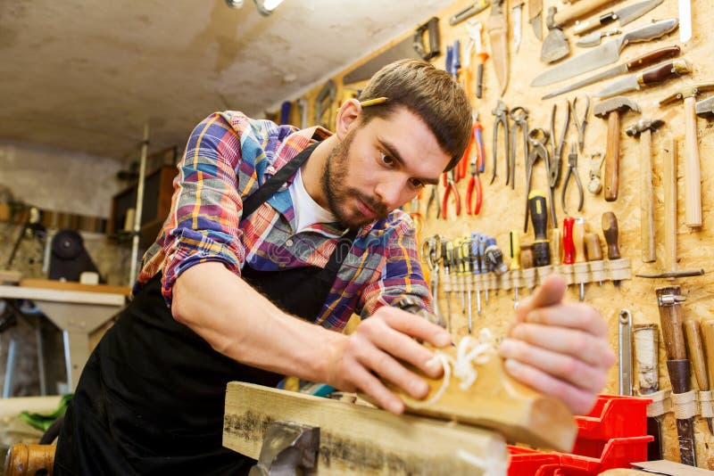 Carpenter Working with Plane and Wood at Workshop Stock Photo - Image ...