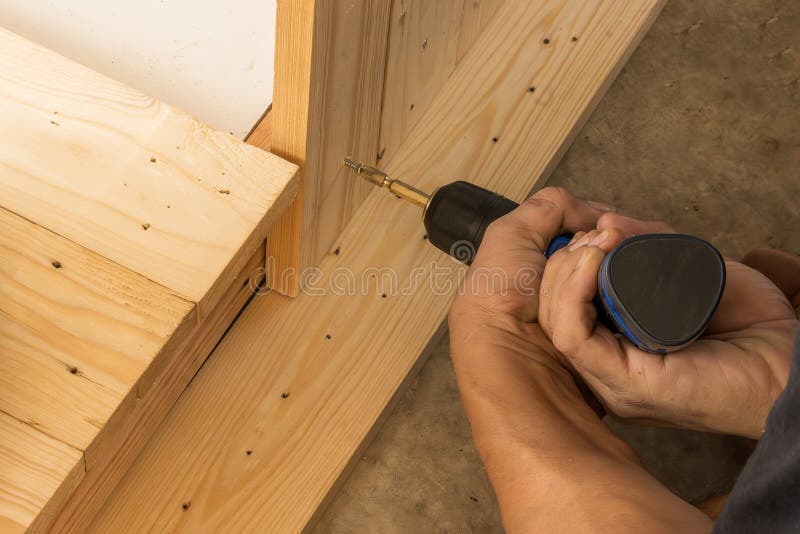 The Carpenter Working with the Power Driver Stock Image - Image of ...