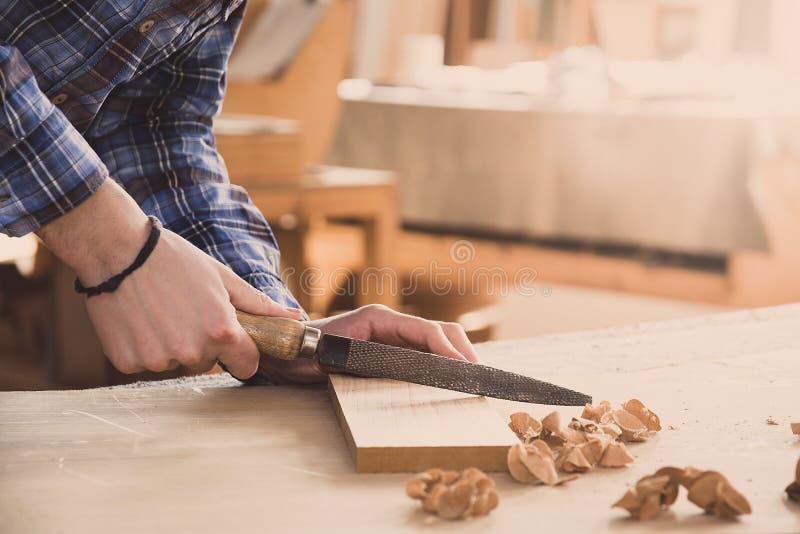 Carpenter Working with Rasp on Wood Using Rasper. Workshop Background ...