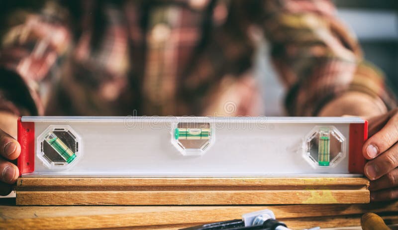 Carpenter Working with a Spirit Level Stock Photo - Image of hand, line ...