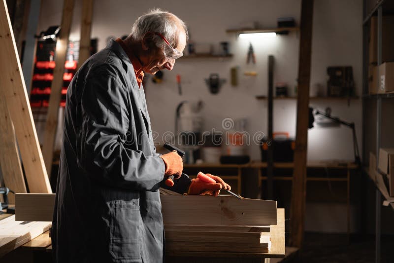 Carpenter Working with Wood Plank Using Chisel and Hammer Stock Photo ...