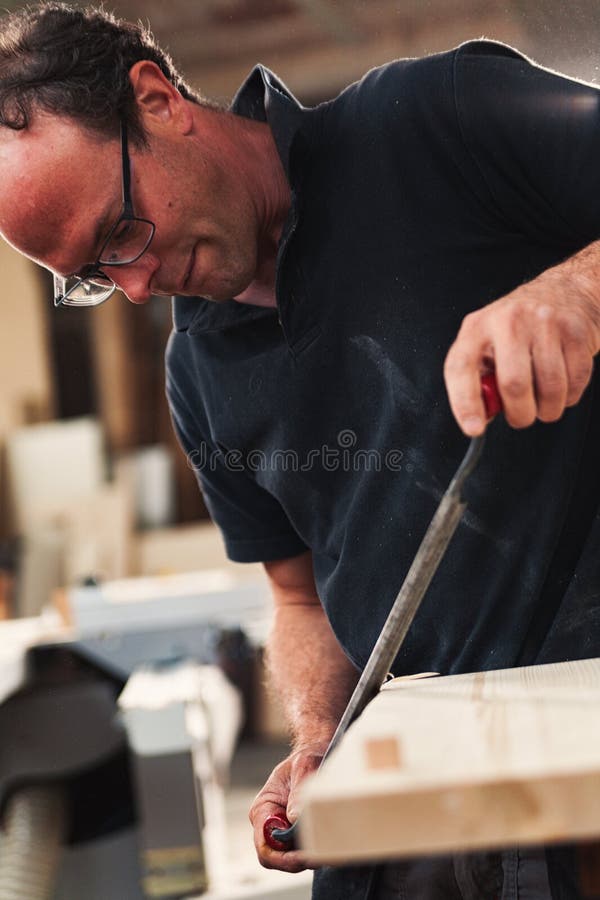 Carpenter Working Wood Plank Using Rasp in Workshop Stock Image - Image ...