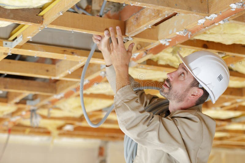 Carpenter Working on Wood Structure on Residential Construction Stock ...