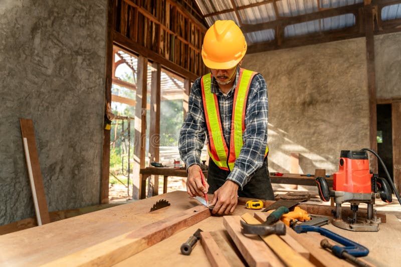A Carpenter Working on Woodworking Machines in Carpentry Shop ...