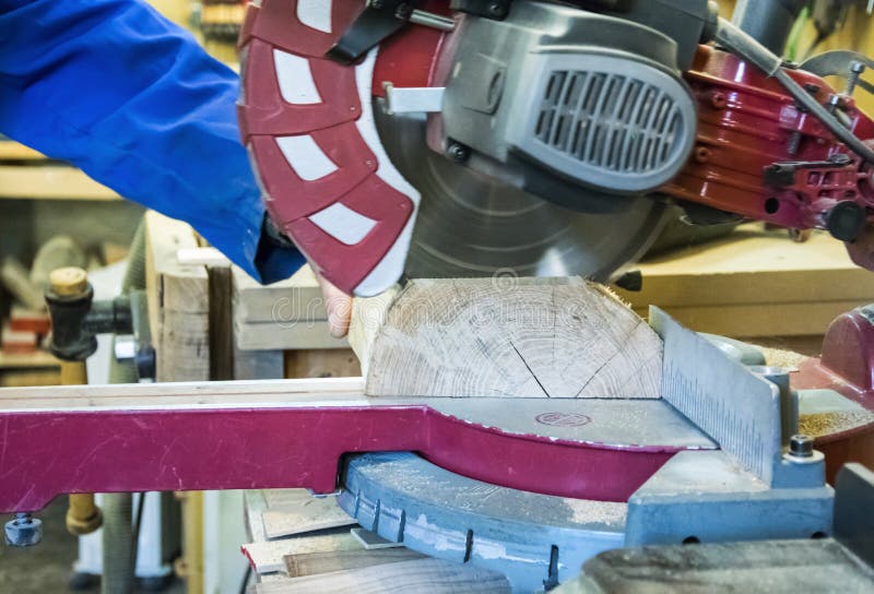Carpenter Workplace- Man Using Circular Saw To Cut Wood Stock Photo ...