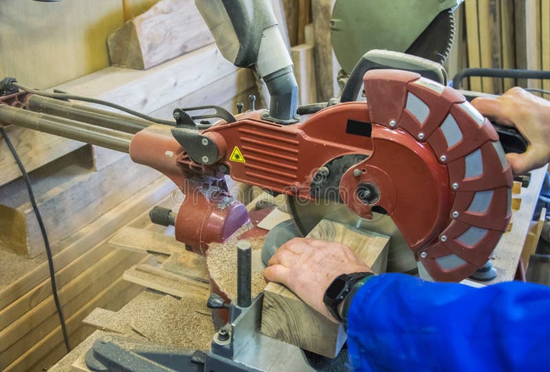 Carpenter Workplace- Man Using Circular Saw To Cut Wood. Stock Image ...