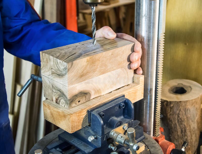 Carpenter Workplace- Man Using a Drill Press on Wood. Stock Image ...