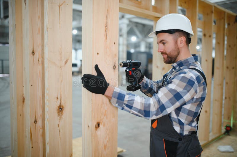A Carpenter Works on the Construction of Modular Houses Stock Image ...