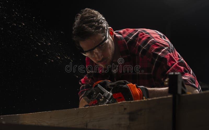 Carpenter Works with Electrical Planer Stock Image - Image of site ...