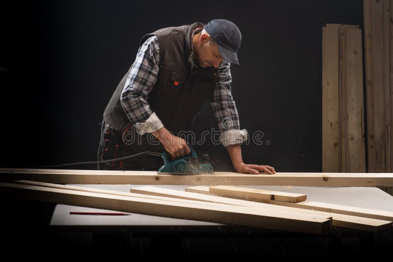 Carpenter Works with Electrical Planer Stock Image - Image of handmade ...