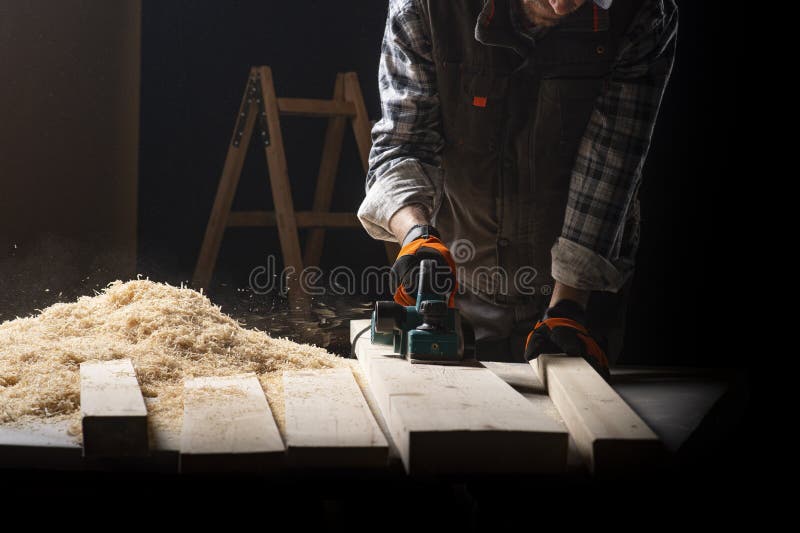 Carpenter Works with Electrical Planer Stock Photo - Image of craftsman ...