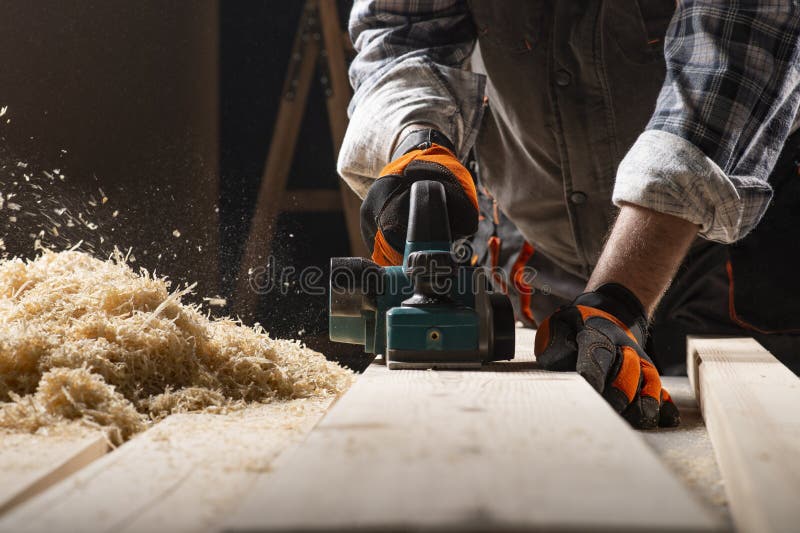 Carpenter Works with Electrical Planer Stock Image - Image of cuttings ...