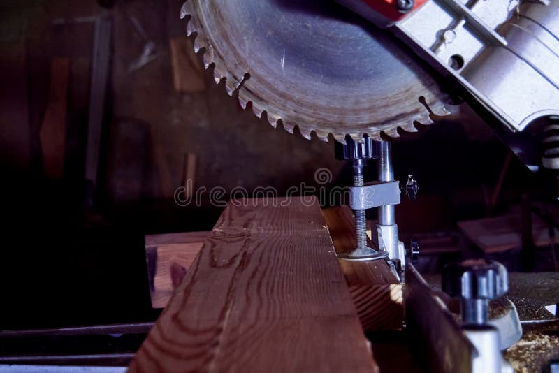 Carpenter Works on Woodworking Machines in the Carpentry Workshop ...