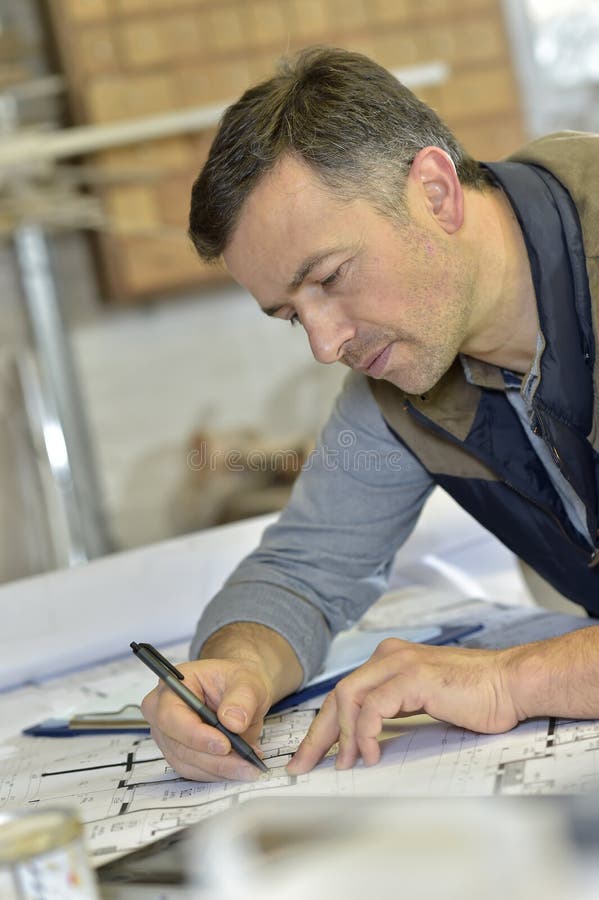Carpenter at Workshop Designing Stock Image - Image of plans, people ...