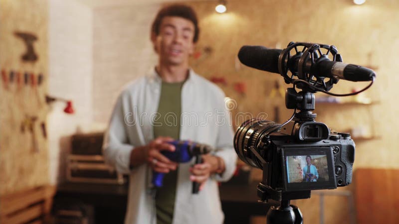 DIY Carpenter Filming a Blog about Drill with Focus on Camera and a ...