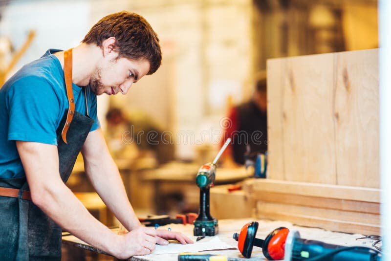 Carpenter at Workstation in Shop Stock Image - Image of shop, table ...