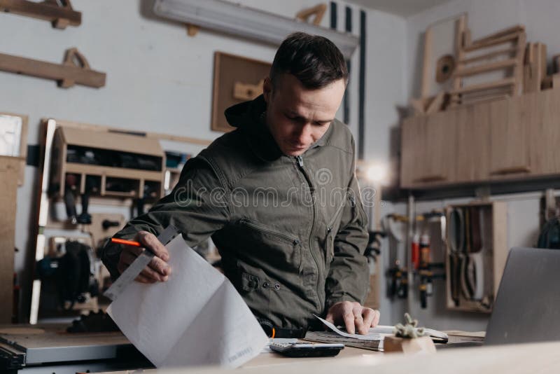 Carpenter Writes on a Notebook, Graphite Pencil and Clipboard with ...