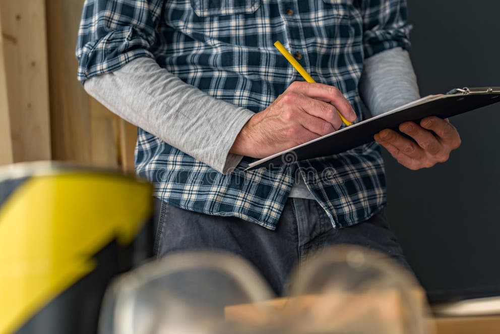 Carpenter Writing Notes on Clipboard Notepad Stock Image - Image of ...