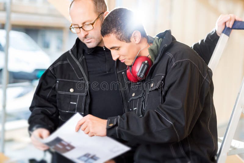 Black Men Carpenter Looking Plans Stock Photos - Free & Royalty-Free ...