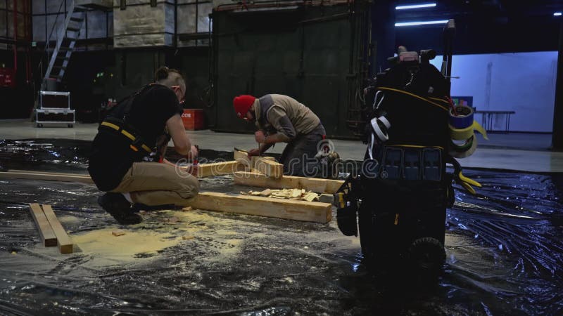 Carpenters Using Professional Equipment at the Workshop. Media. Working ...