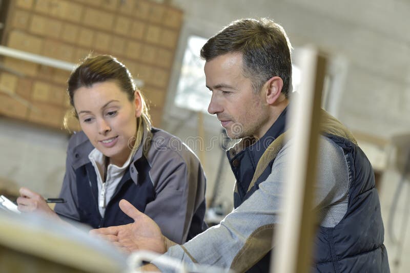 Carpenters Working on Plans Stock Photo - Image of carpenter ...