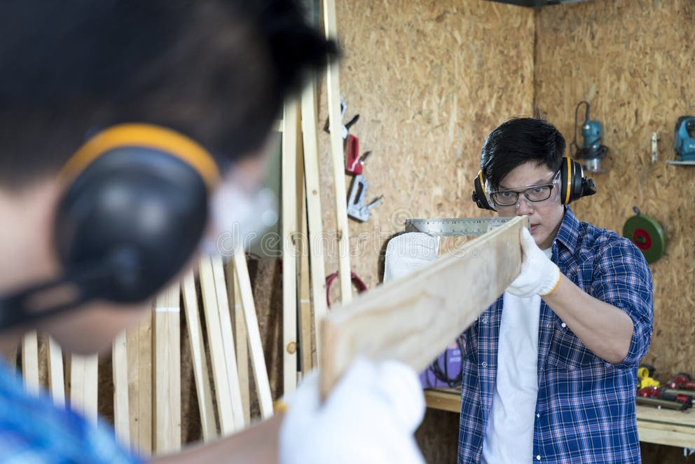 Carpenters Working in Teamwork. Two Young Man As Carpenter Work in the ...