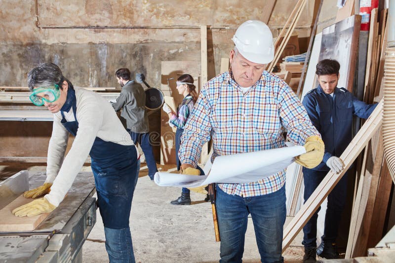 Carpenters Working Together Stock Photo - Image of board, profession ...