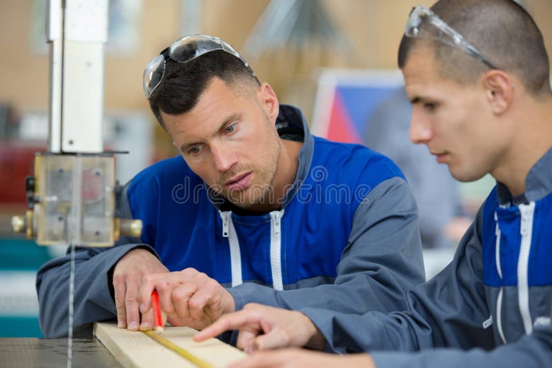 Carpentry Apprentice Demonstrating Machine Operation Stock Image ...