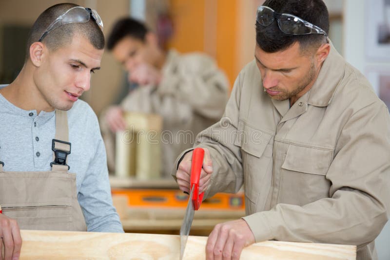 Carpentry Apprentice Demonstrating Machine Operation Stock Image ...