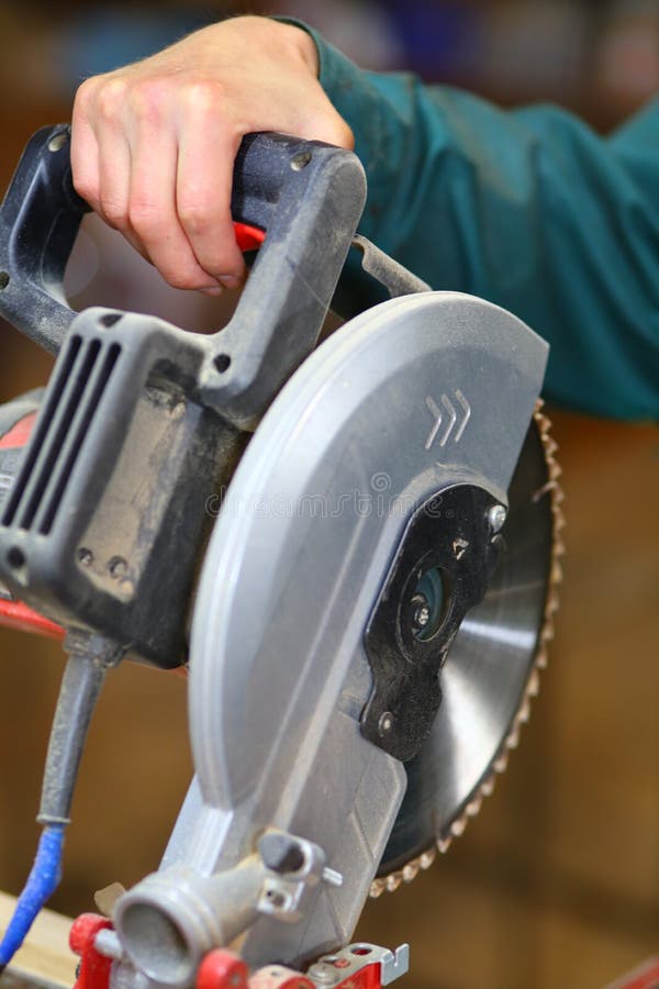 Carpentry Cutting Machine and Hand Close-up Stock Photo - Image of ...