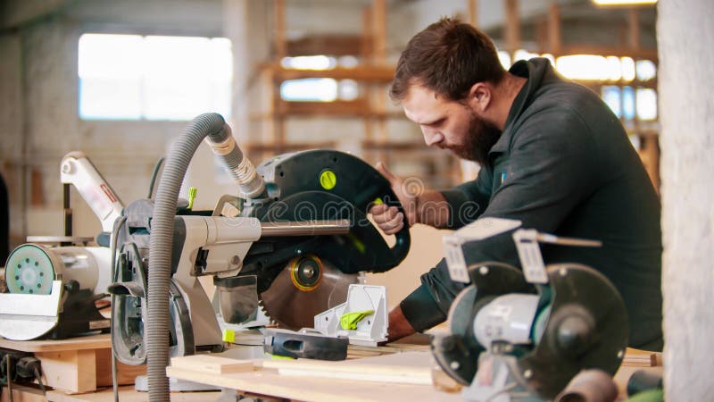Carpentry Industry - Man Working in the Workshop by the Table with a ...