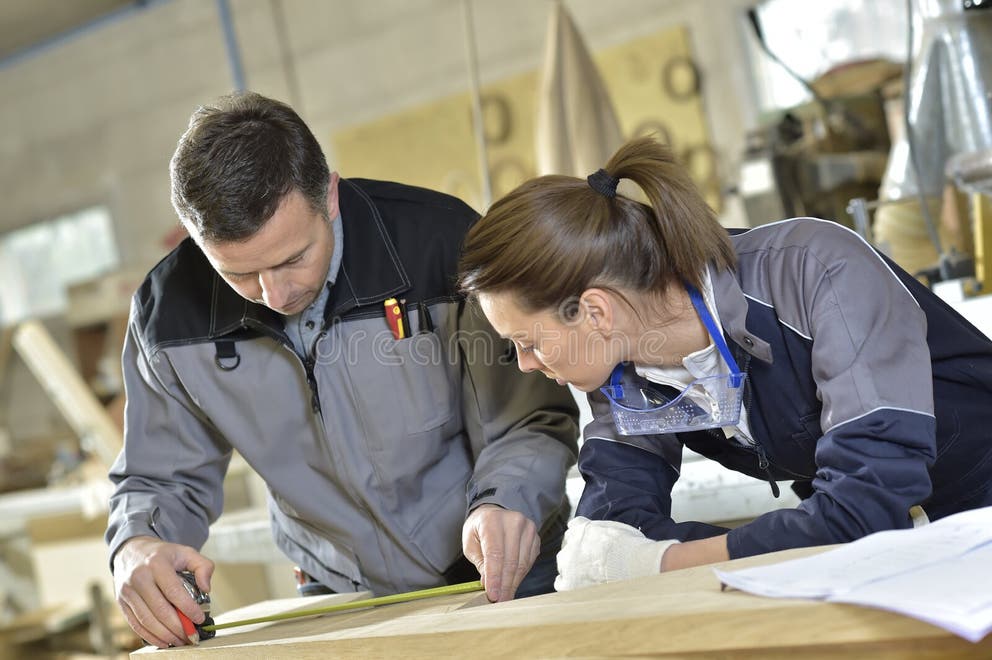 Carpentry Instructor with Trainee in Workshop Stock Photo - Image of ...