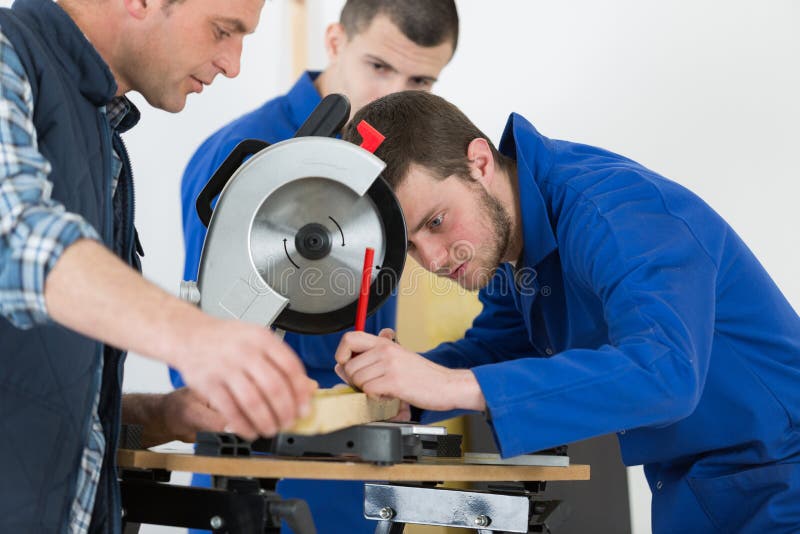 Carpentry Teacher Showing Sawing Machine To Students Stock Photo ...