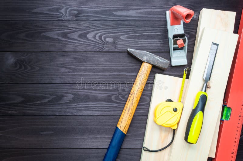 Carpentry Tools and Boards on a Dark Workbench. Copy Space Stock Image ...