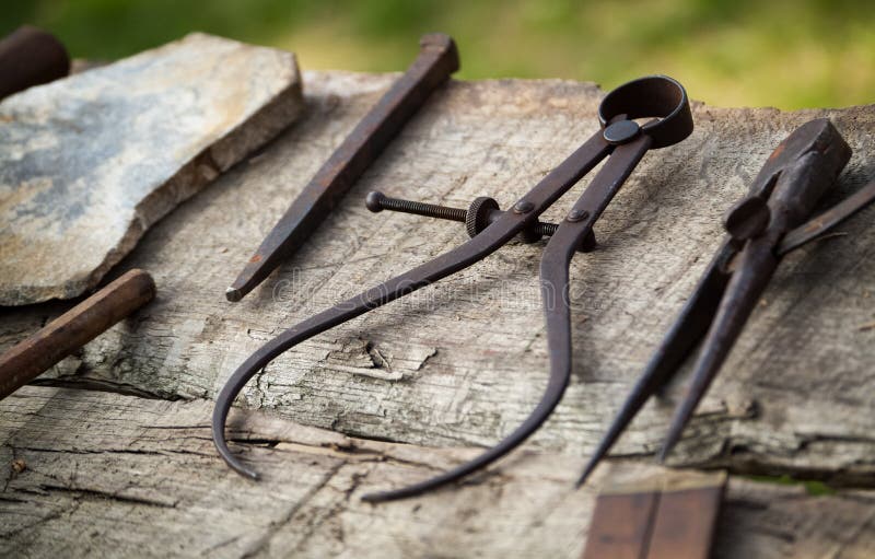 Historical Tools Of A Blacksmith At A Medieval Market Such As Hammer ...
