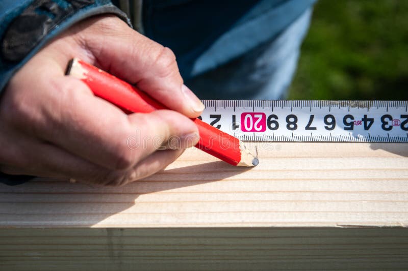 Carpentry Work, Putting Measurements on Wood with a Pencil Stock Photo ...