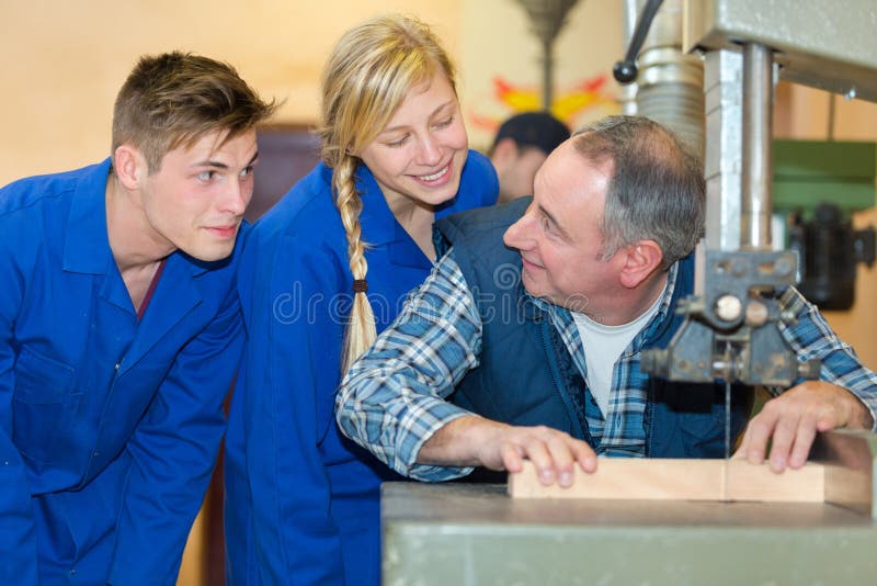 Carpentry Worker Demonstrating Bandsaw Procedure Stock Photo - Image of ...