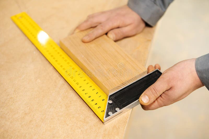 Carpentry Works. the Process of Measuring a Board with a Ruler To ...