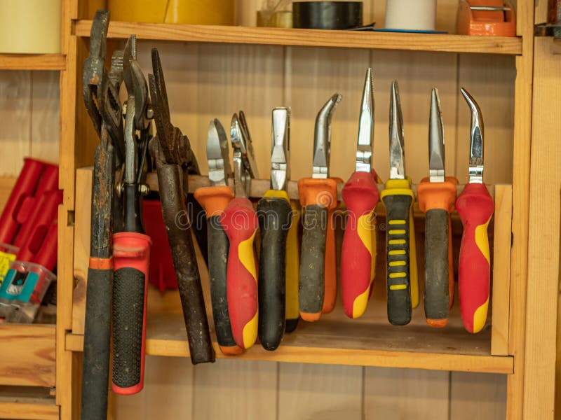 Carpentry Workshop. Instruments. a Set of Pliers Hangs on the Shelf ...