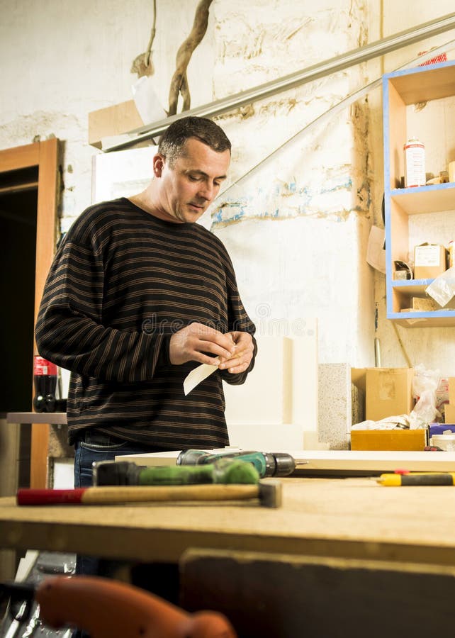 Carpentry workshop routine stock image. Image of cabinet - 88560491