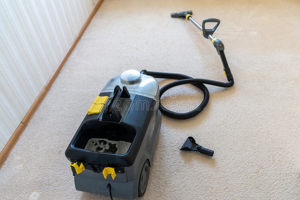Carpet Cleaning Machine on Beige Carpet with Attachment and Hose Stock ...