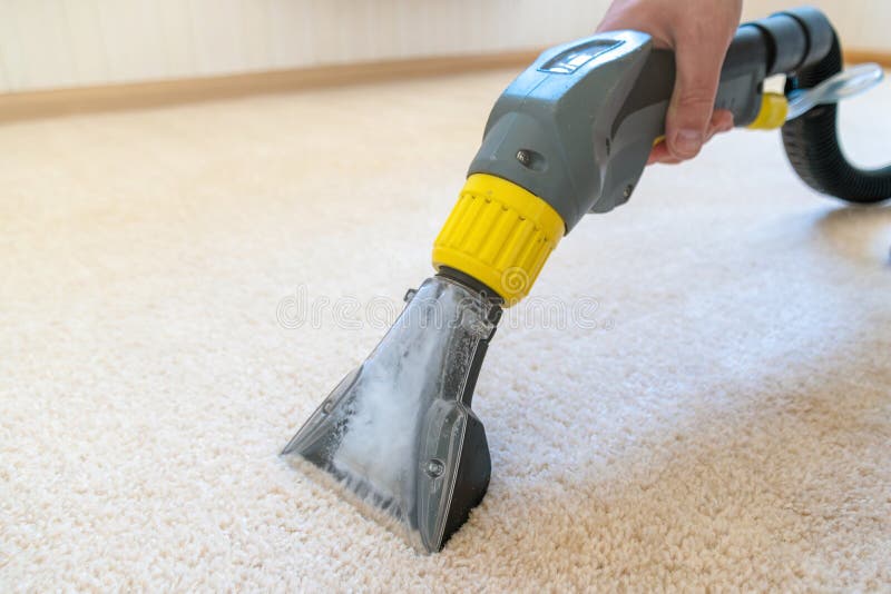 Carpet Cleaning Machine in Use on Light-colored Rug Stock Photo - Image ...