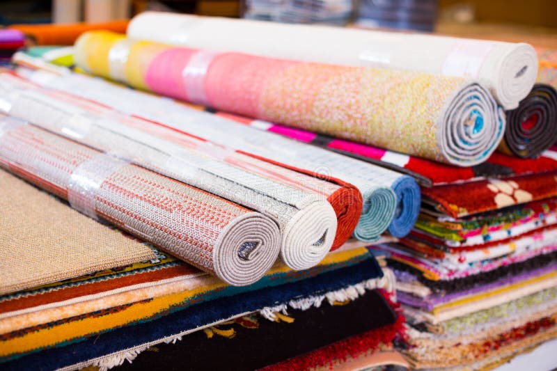 Carpets of Different Colours in Stack at Carpet Store Stock Image ...